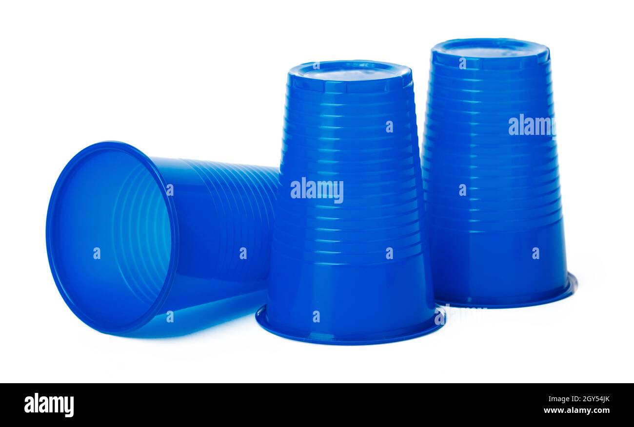 Pile of plastic cups on white background Stock Photo - Alamy