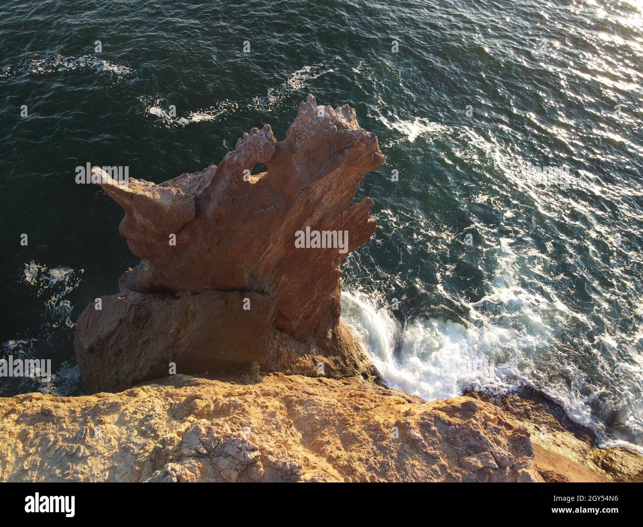 Dragon head arise from the water - The rock or lava formation with the ...