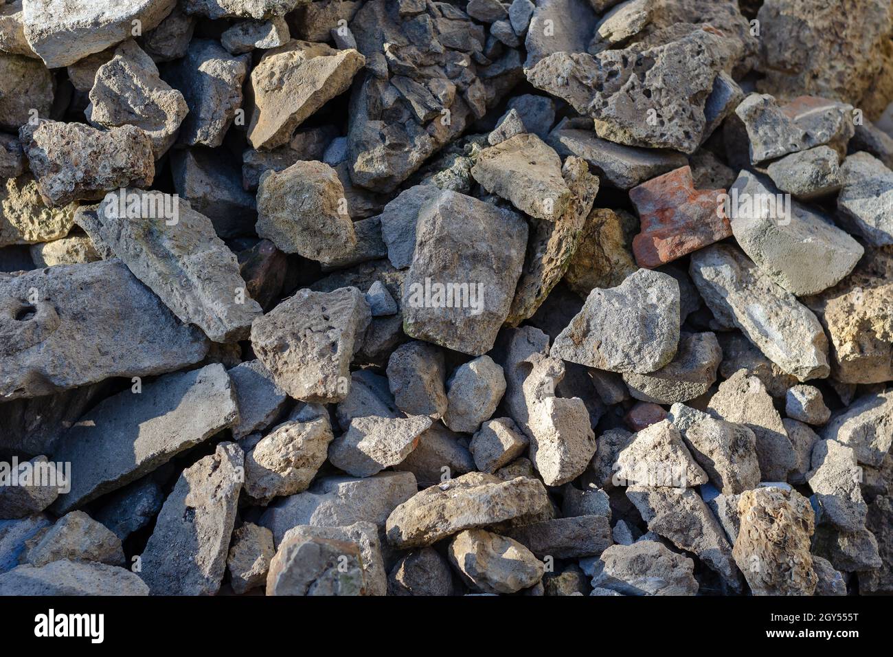 Construction debris full frame. Random rocks, bricks, pieces of ...