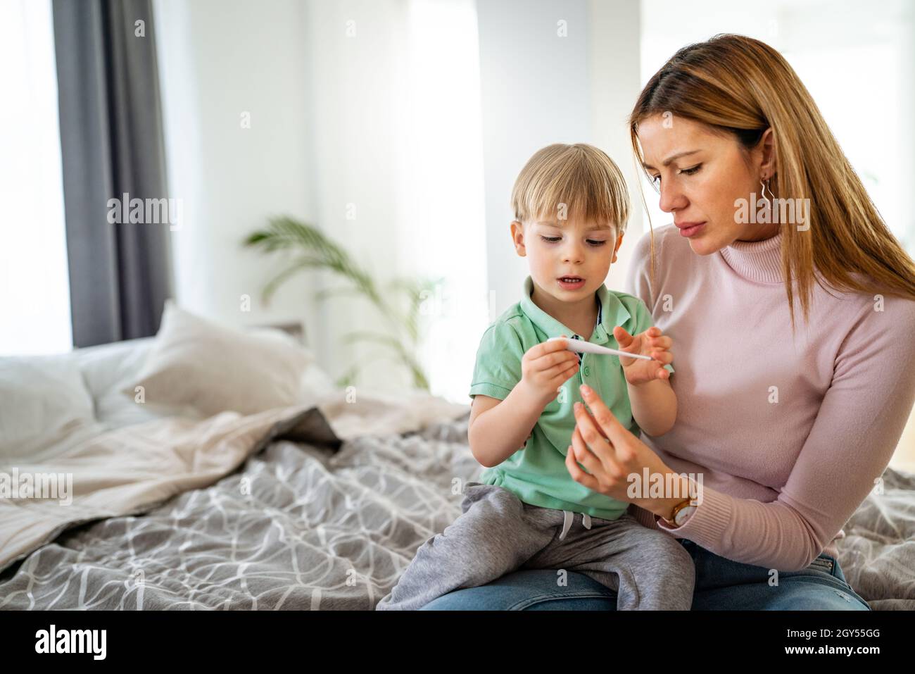 Sick child thermometer hi-res stock photography and images - Alamy