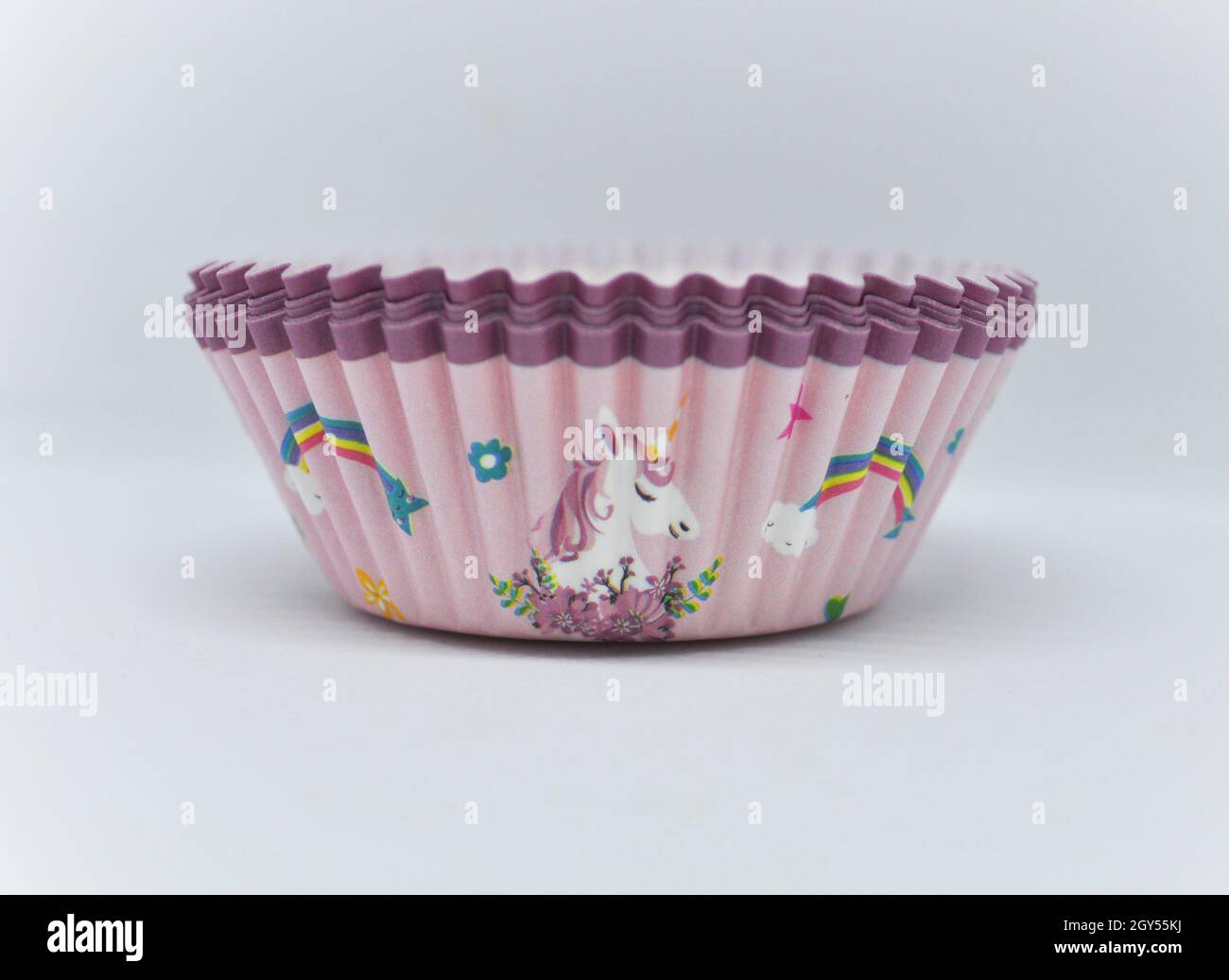 Empty unicorn cup cake cases set against a white background Stock Photo ...