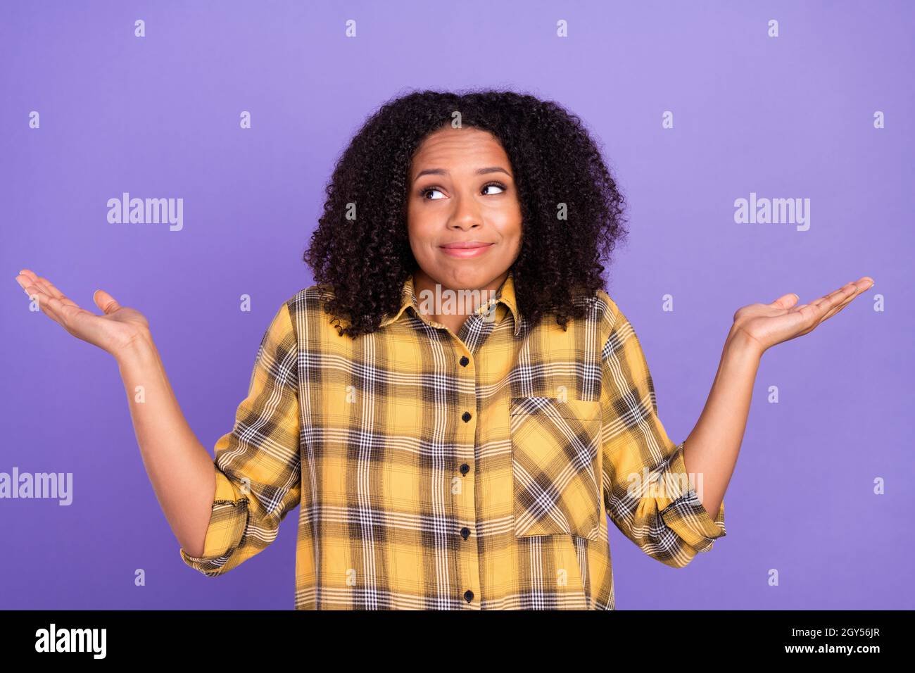 Photo of clueless attractive dark skin woman look empty space no idea ...