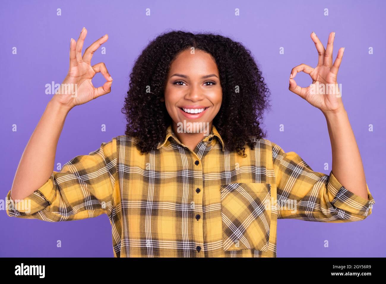 Photo of positive happy dark skin woman show okay sign good mood advice ...