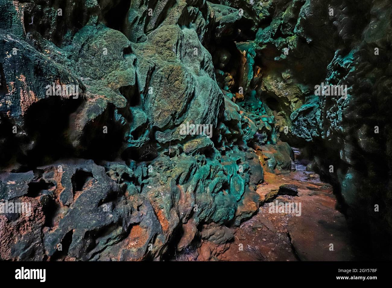 Colourful cave deposits of copper & iron in this popular scenic eroded ...