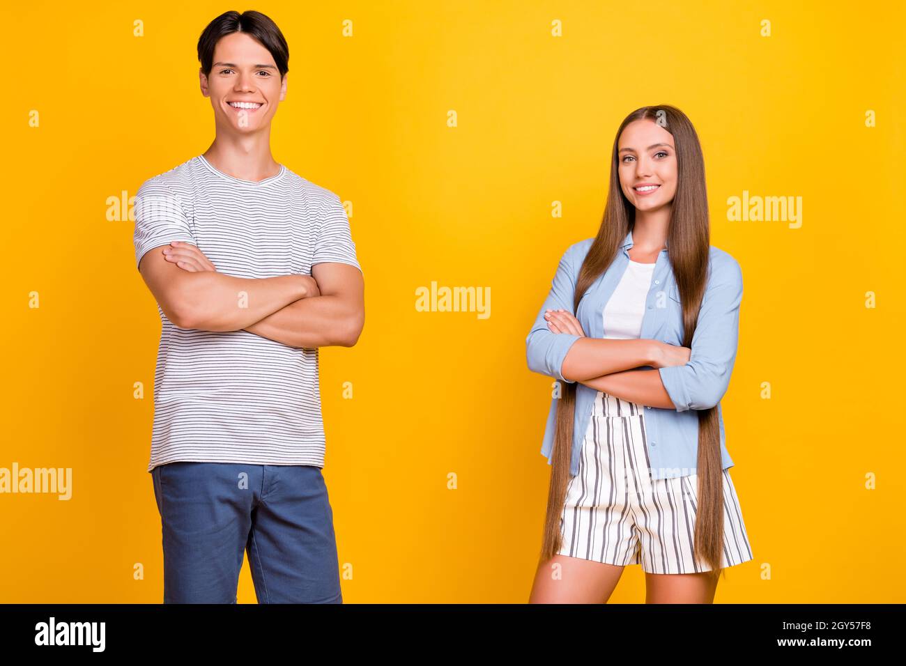 Portrait of attractive content cheerful couple partners coworkers ...