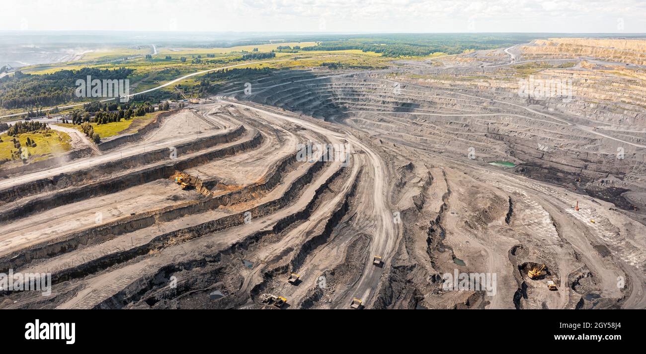 Panoramic aerial view of coal mine. Open pit mine industry, big yellow ...