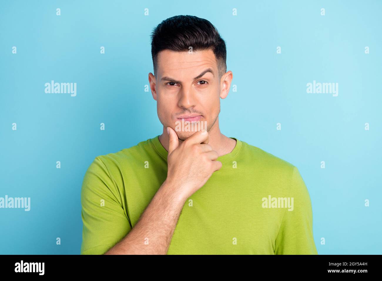 Photo portrait man in green t-shirt thoughtful got idea isolated pastel ...