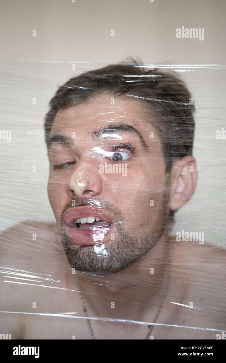 distorted male portrait, funny face facial expressions Stock Photo - Alamy
