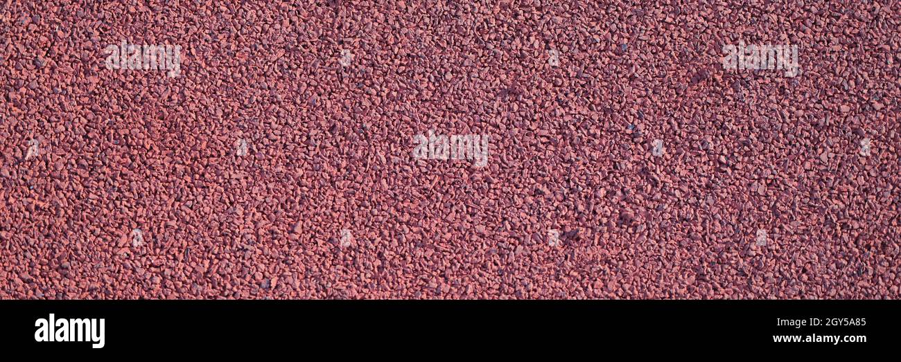 Closeup of red rubber floor covering for playground Stock Photo - Alamy