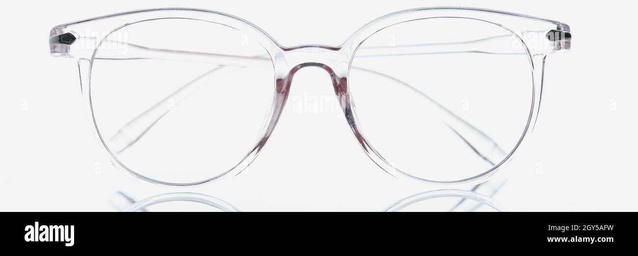 Closeup of transparent glasses for vision on white background with ...
