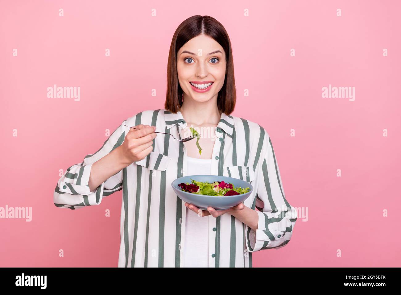 Photo of young cheerful girl happy positive smile eat salad food tasty ...