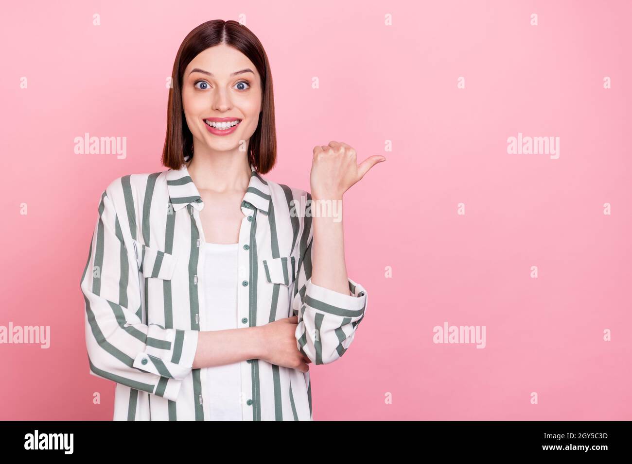Photo of young girl happy positive smile point thumb empty space ad ...