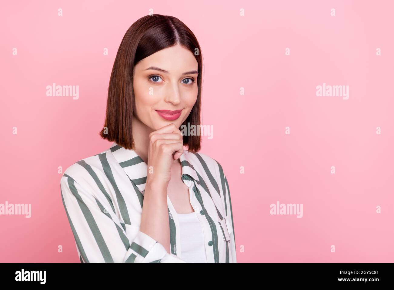 Photo of thinking brunette millennial lady hand face wear white shirt ...