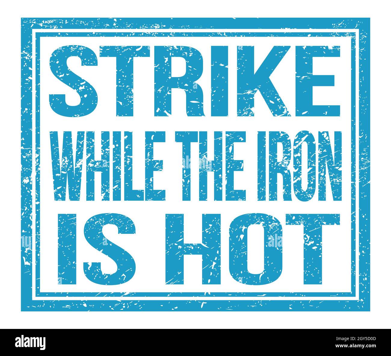 STRIKE WHILE THE IRON IS HOT, written on blue grungy stamp sign Stock ...