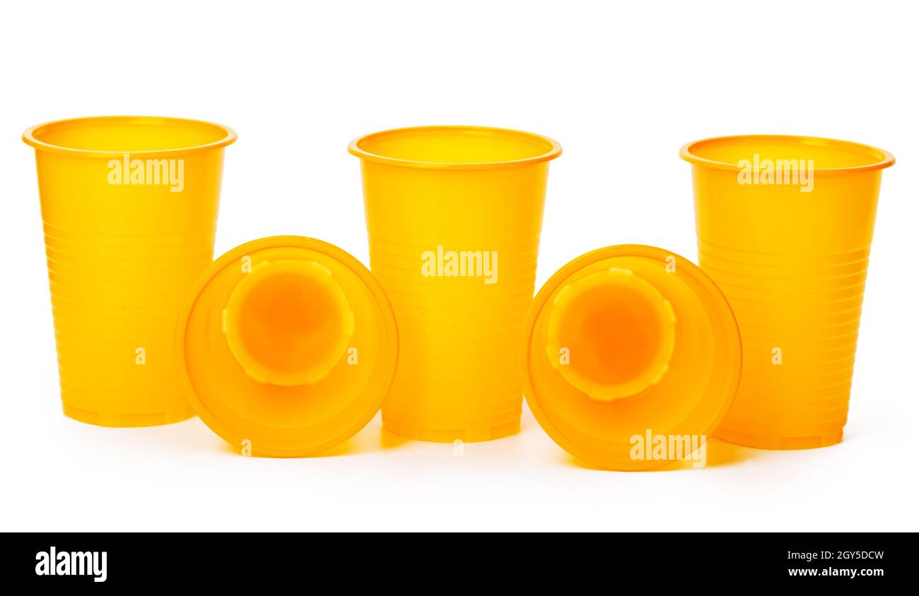 Pile of plastic cups on white background Stock Photo - Alamy