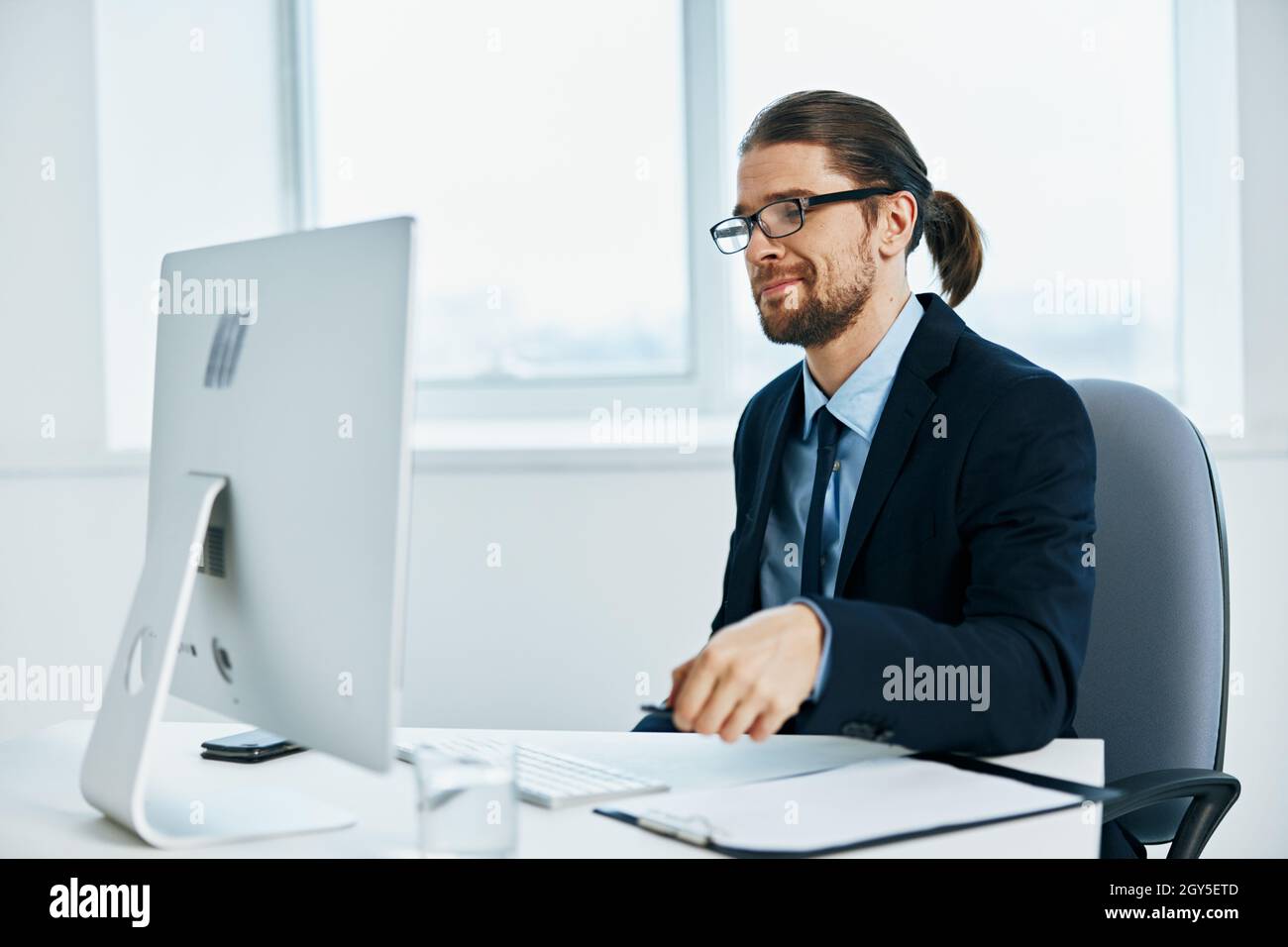 office worker at the desk with glasses work technologies Stock Photo ...