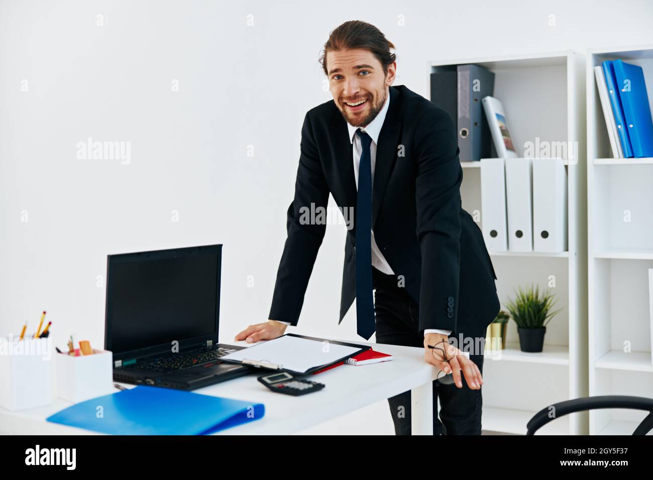 manager holding a phone telephone office lifestyle Stock Photo - Alamy