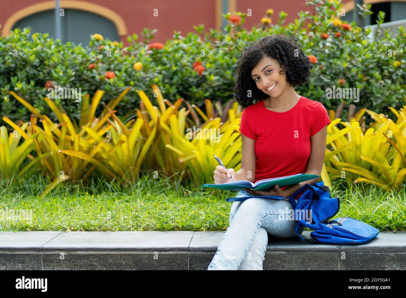 Pretty spanish female student learning at campus of university Stock ...