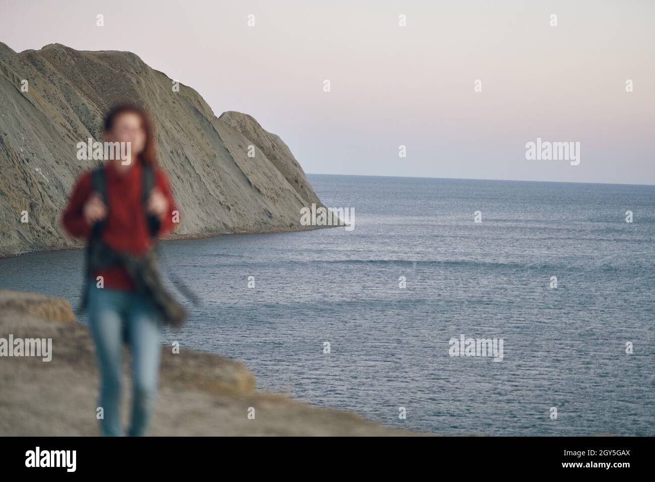 woman hiker in mountains travel with backpack landscape Stock Photo - Alamy