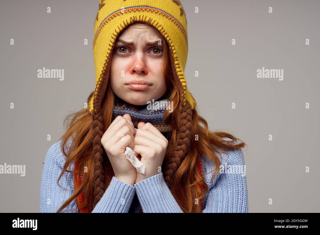 red-haired woman health problems temperature light background Stock ...