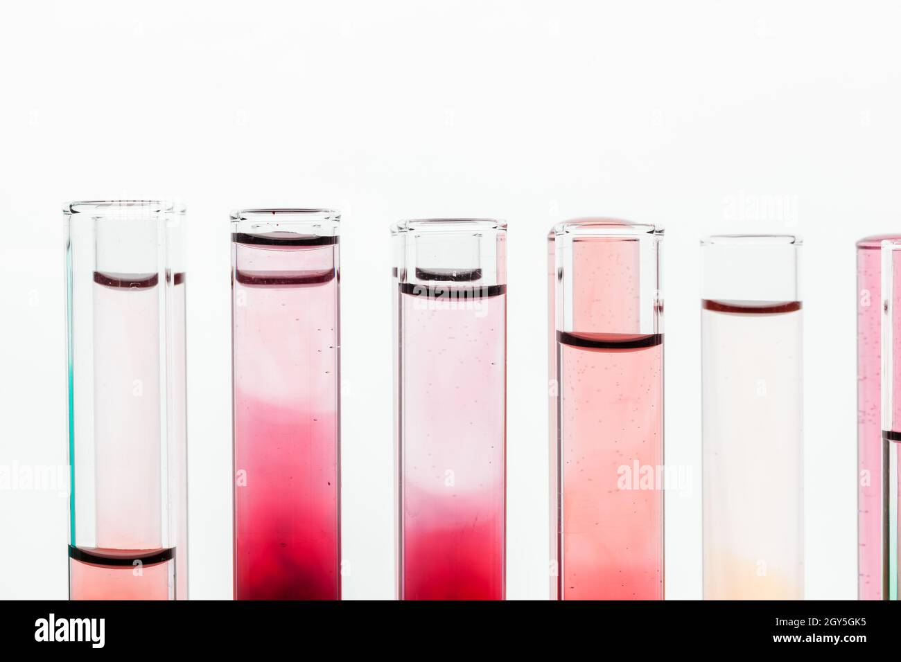 Glass laboratory chemical test tubes with liquid for analysis close up ...