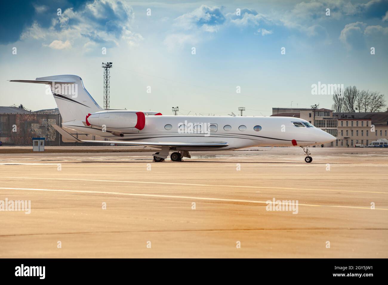 Small white plane at the airport. Runway. Charter flight. Flight on a ...