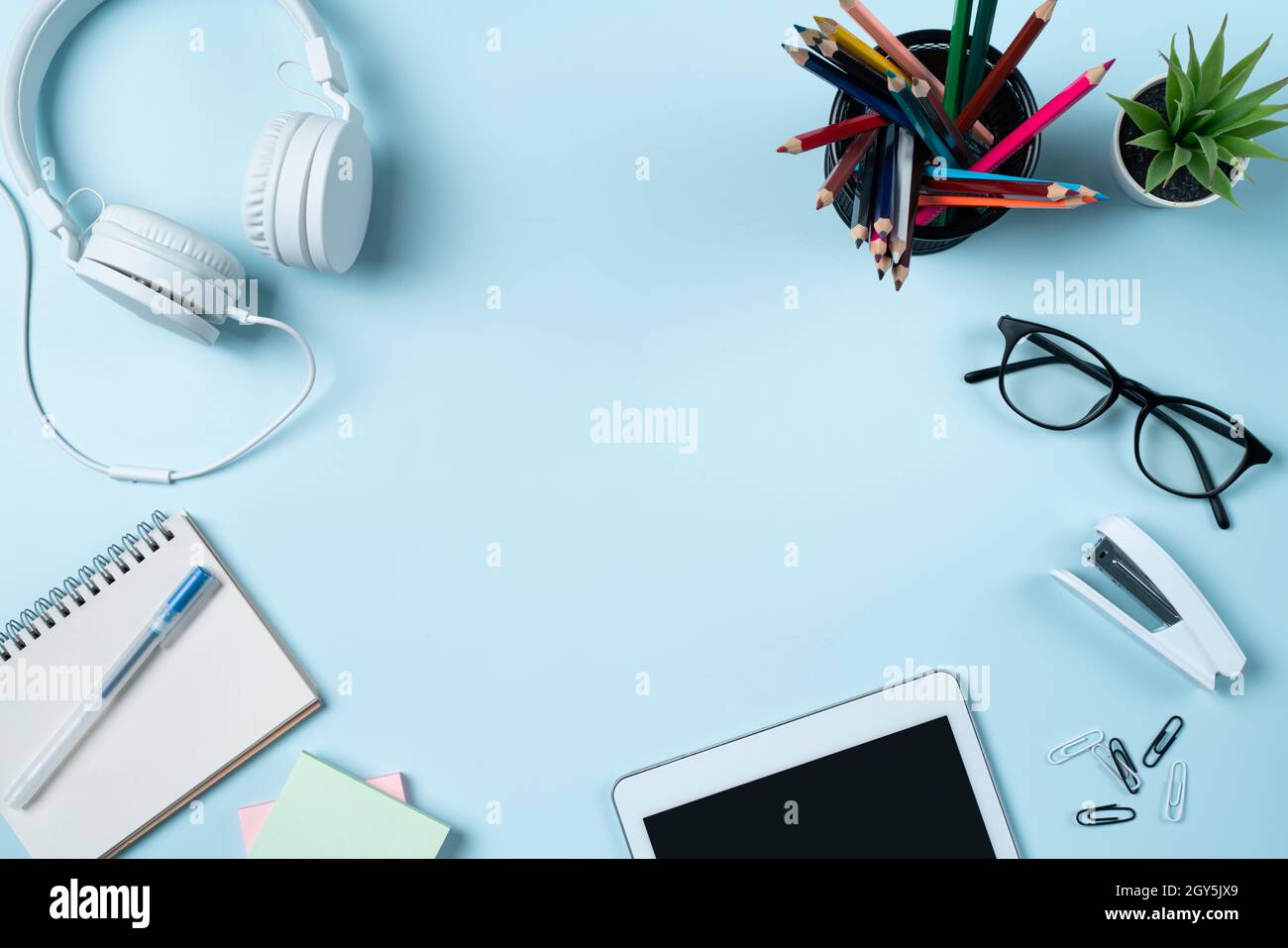 Online learning design concept. Top view of student table with tablet ...
