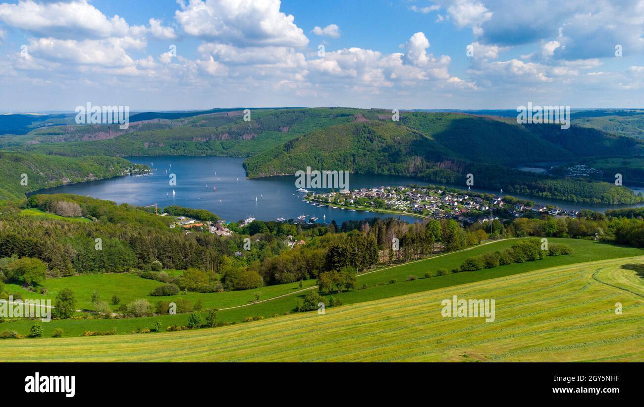Aerial view of the Rursee in the Eifel region, Germany with farmland in ...