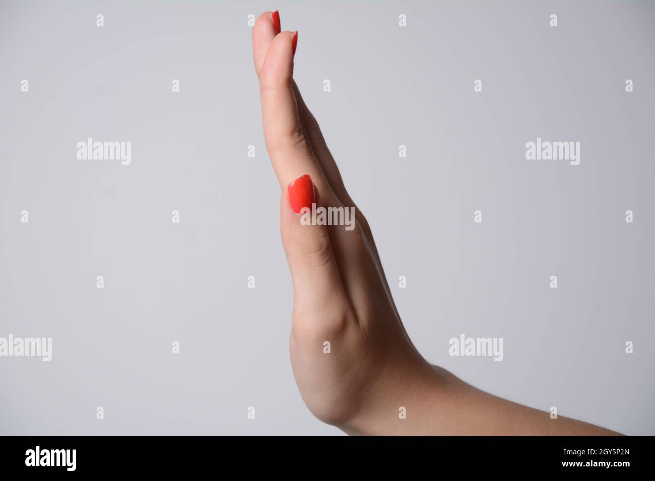Woman hand show stop sign isolated on white background Stock Photo - Alamy