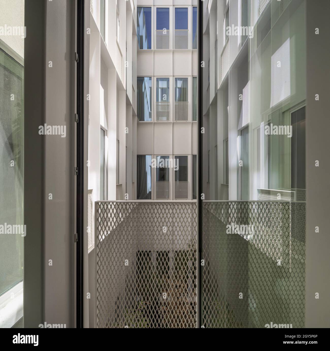 View through window to interior courtyard. Ribeira 11, Lisbon, Portugal ...