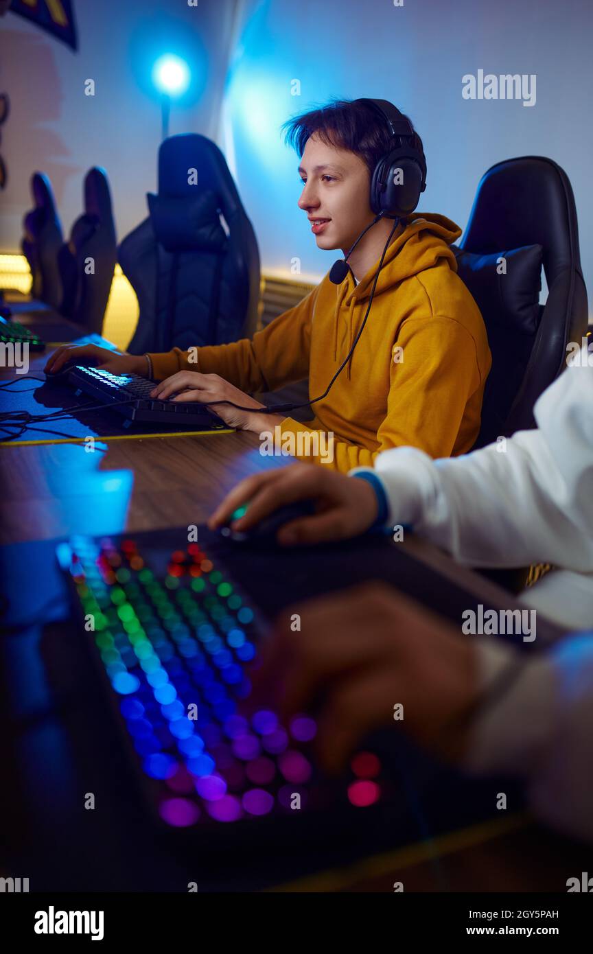 Two young gamers play in game club. Virtual entertainment, e-sport ...