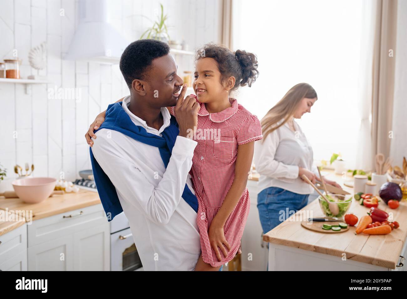 Happy family, nice breakfast on the kitchen. Mother, father and their ...
