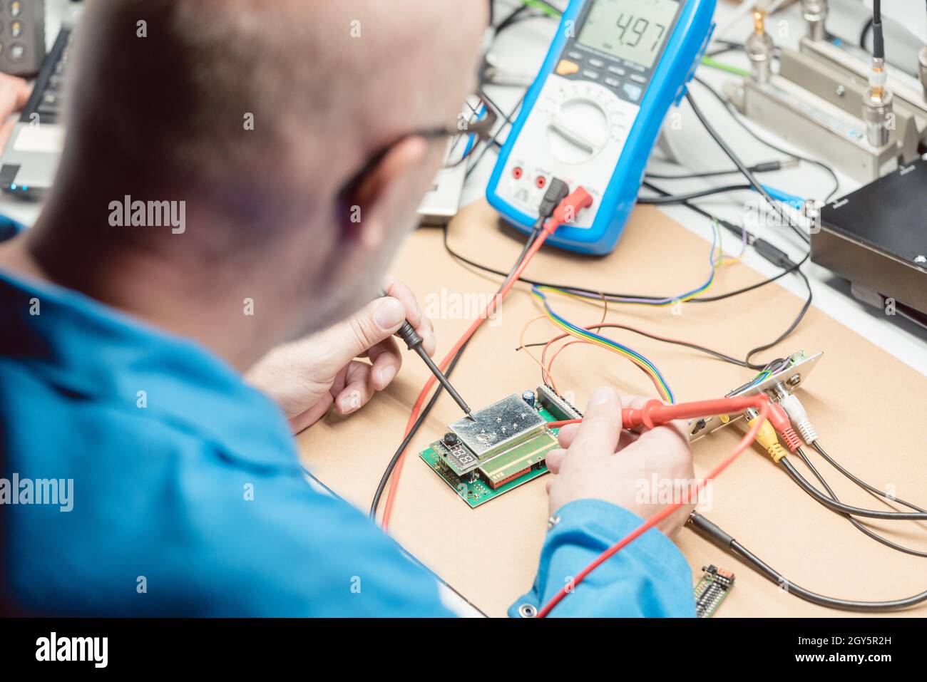 Electronic engineer designing and developing a new and innovative ...