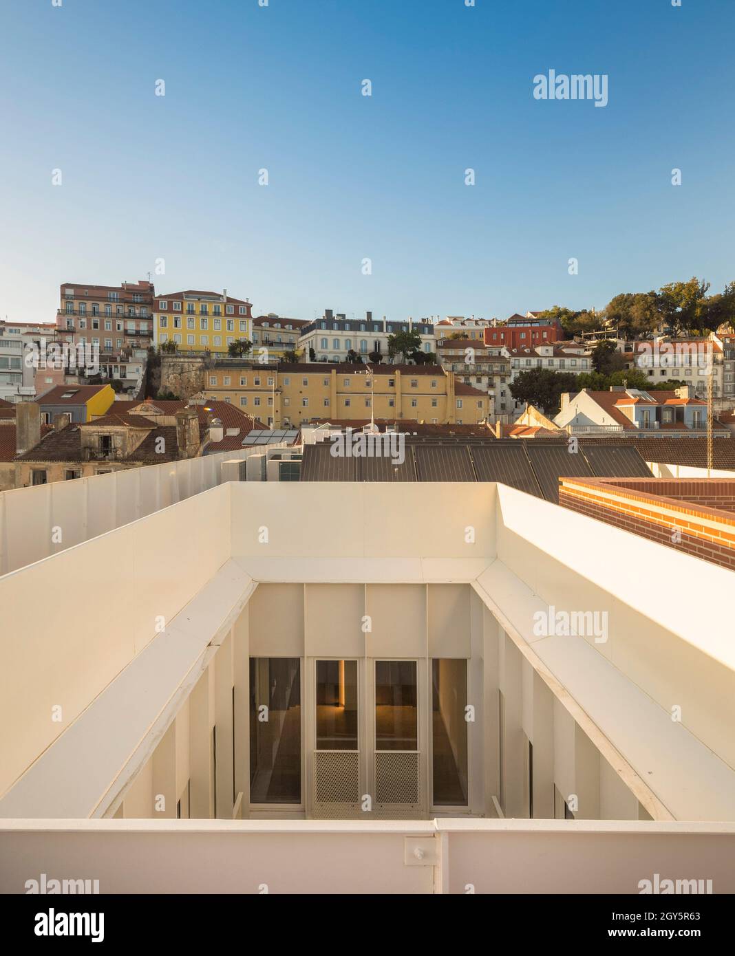 View from roof of cityscape and interior courtyard facade. Ribeira 11 ...
