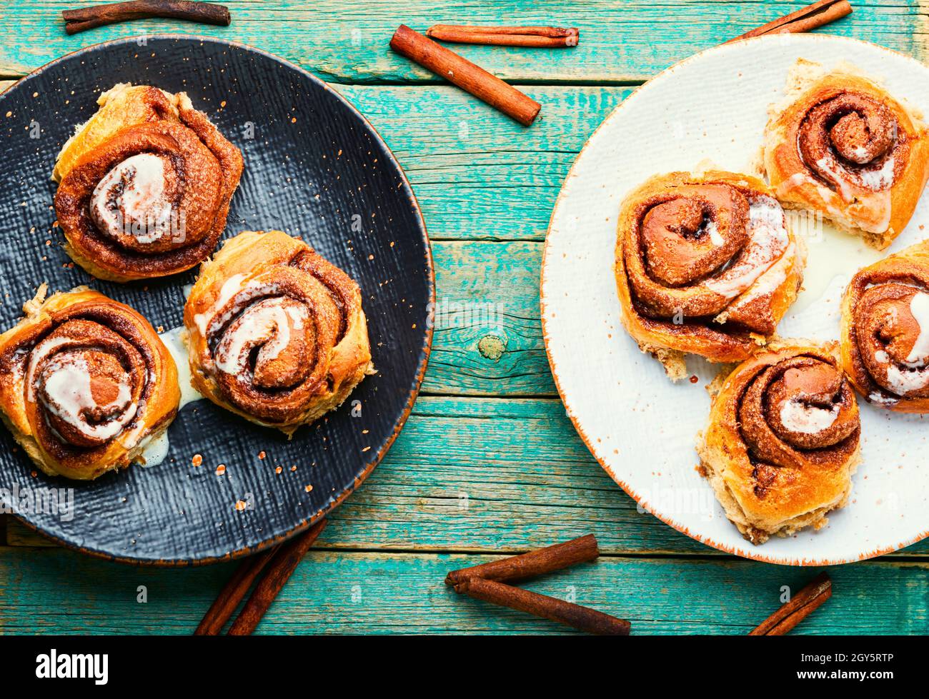 Cinnabones with cinnamon and mascarpone cheese.Homemade cinnabons on a ...