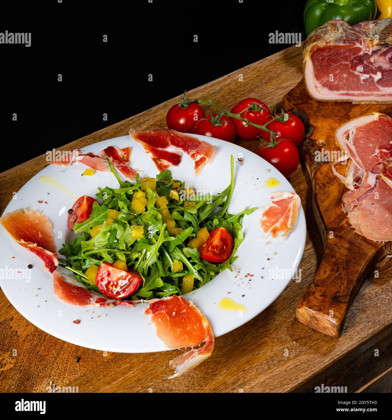 Rocket salad with dried Spanish ham Stock Photo - Alamy