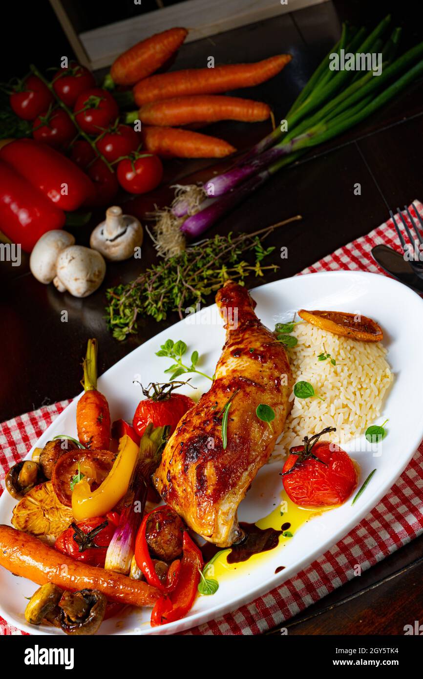 Rustic fried chicken legs with assorted vegetables and rice Stock Photo ...