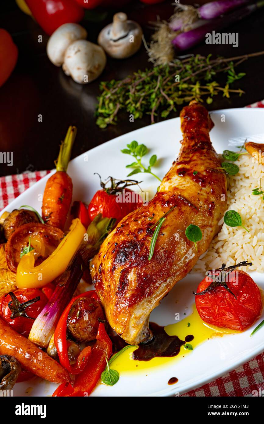 Rustic fried chicken legs with assorted vegetables and rice Stock Photo ...