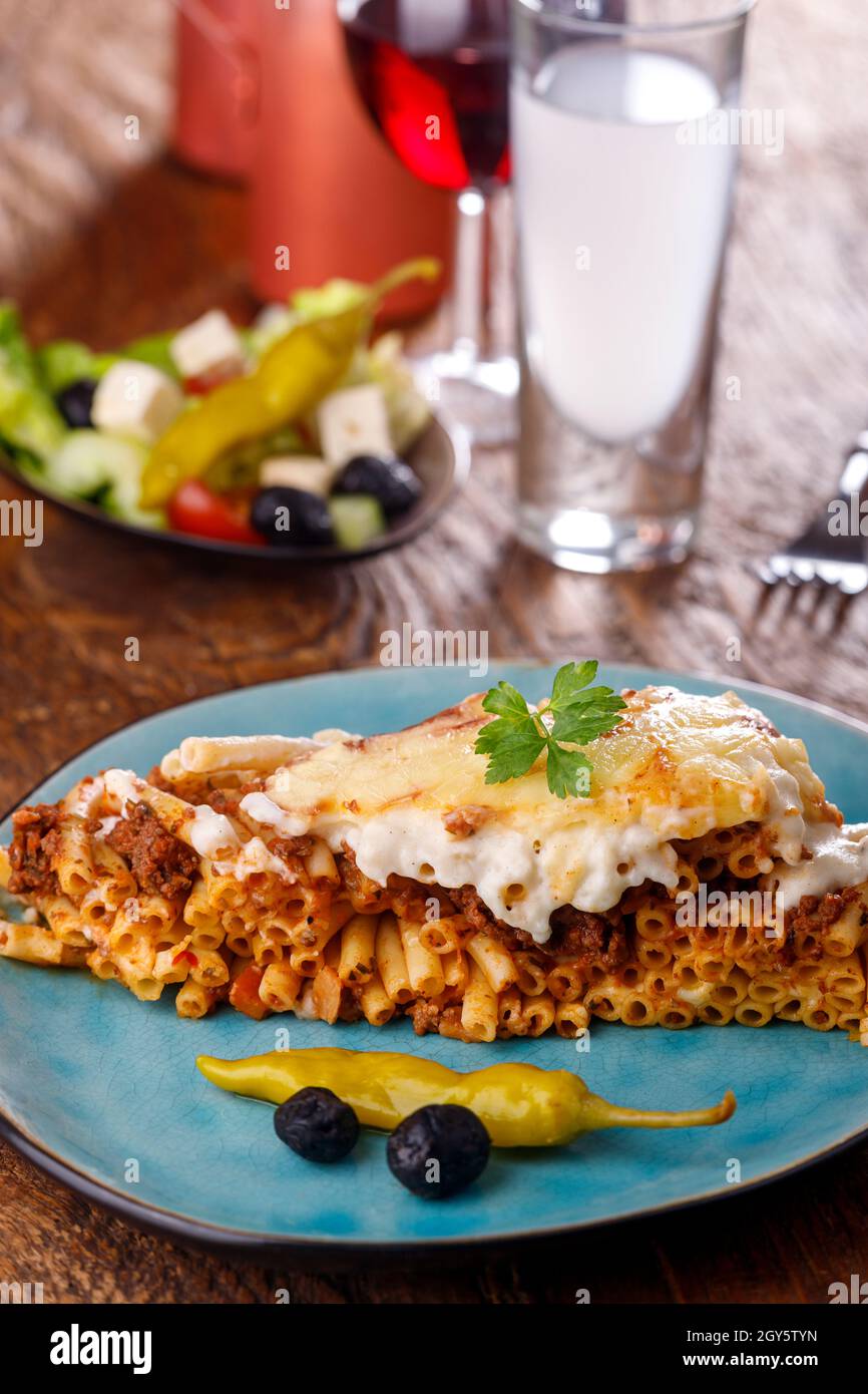 greek Pastitsio dish on a blue plate Stock Photo - Alamy