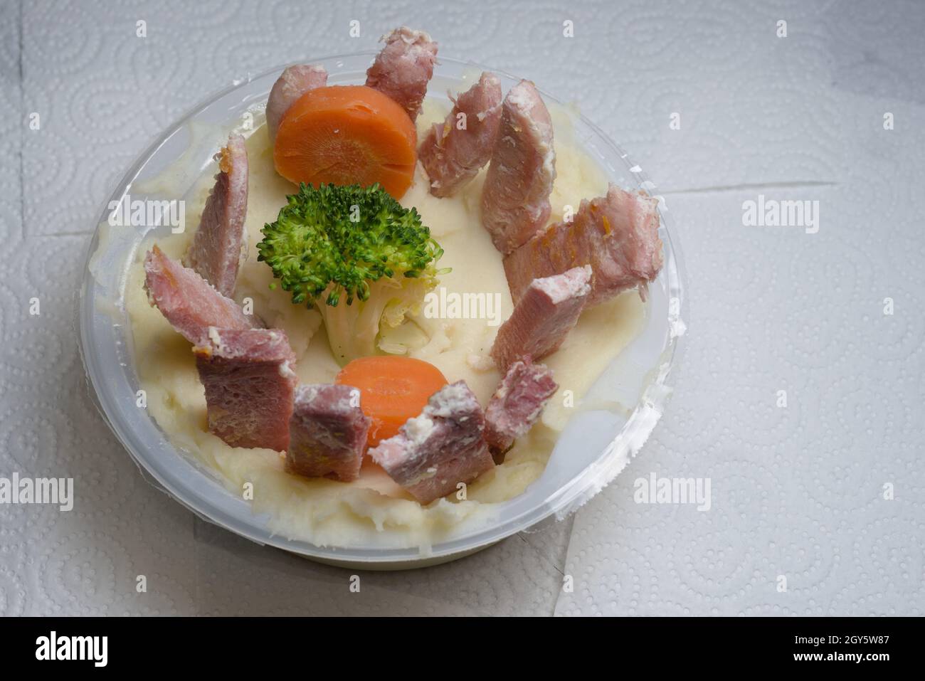Artistic british cuisine, on a plain white kitchen tissue background ...
