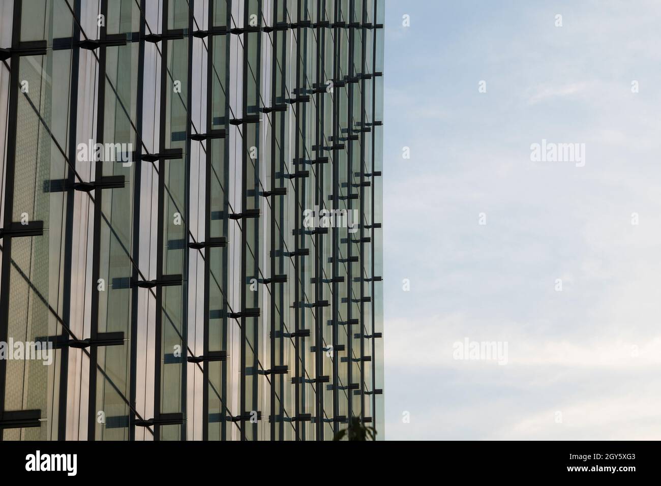 Blue sky and glass facade of high-rise building in Singapore Stock ...