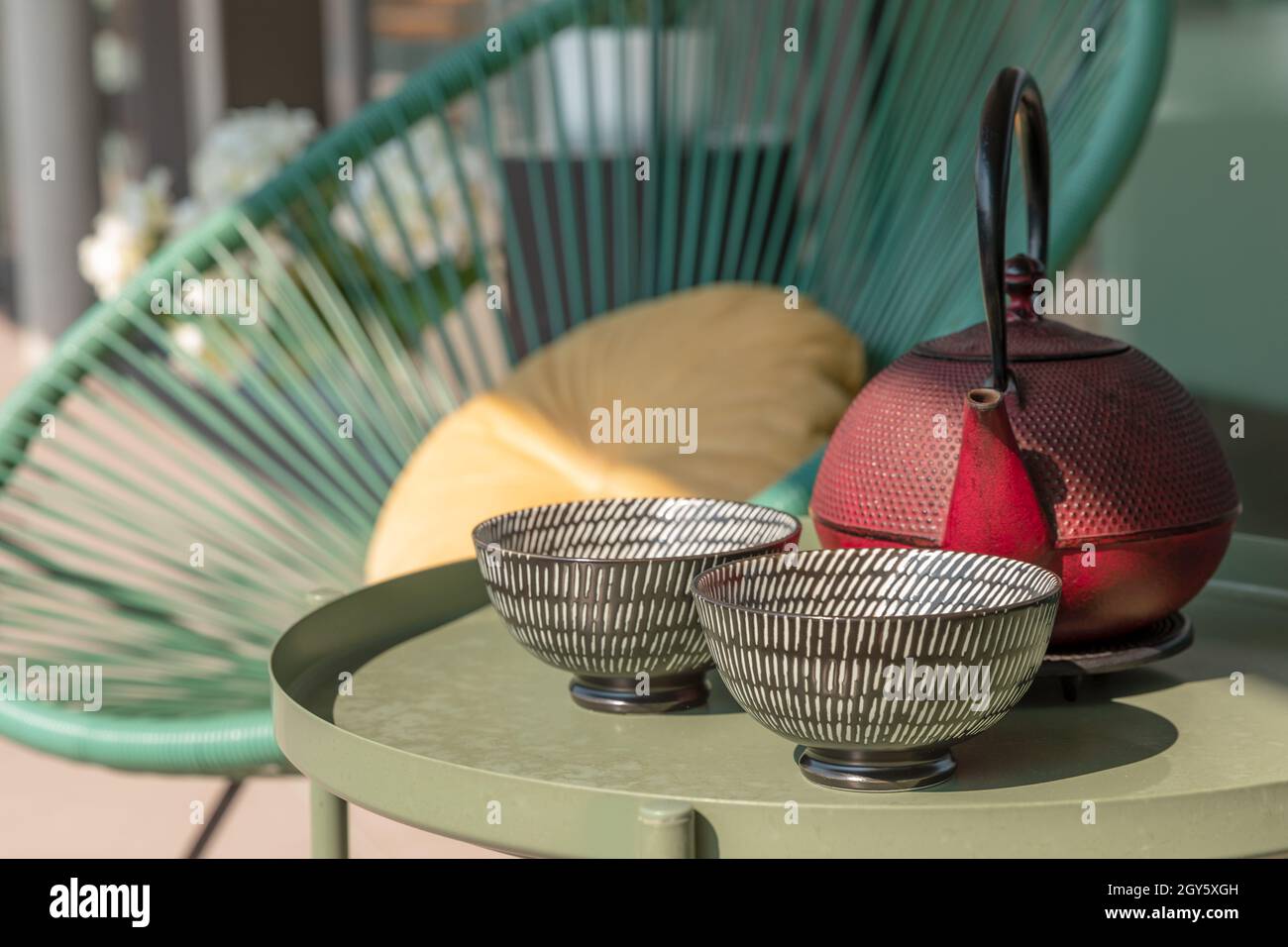 Elegant corner of a terrace of a modern house with two armchairs and a ...