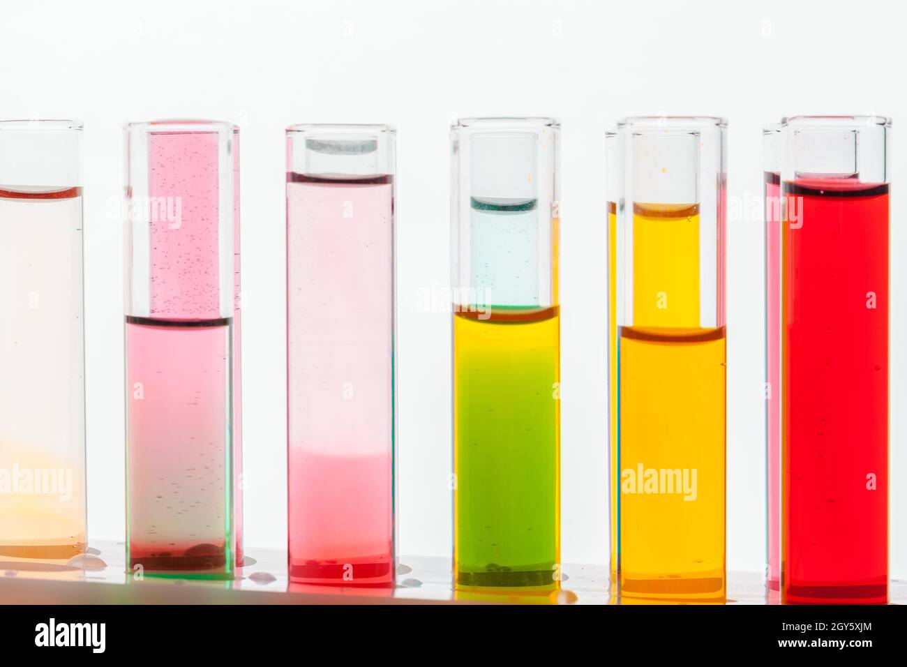 Glass laboratory chemical test tubes with liquid for analysis close up ...