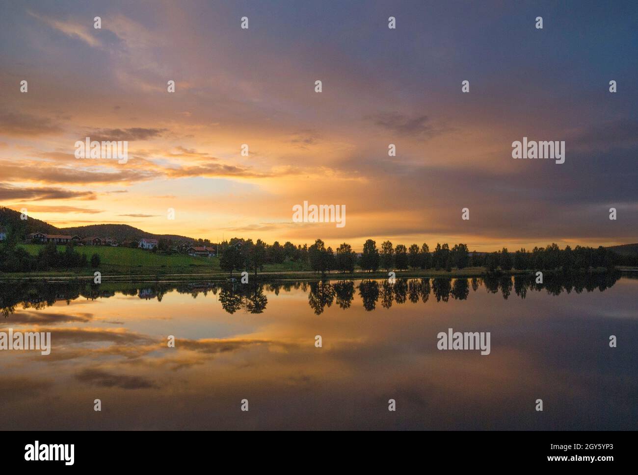 Sunset over the Ljusnan river near the Swedish village Jarvso Stock ...