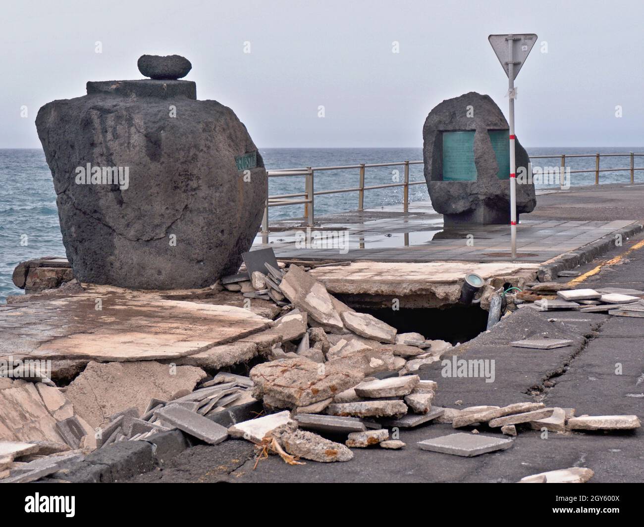 A storm with very high waves sank the ground under the footpath by the ...