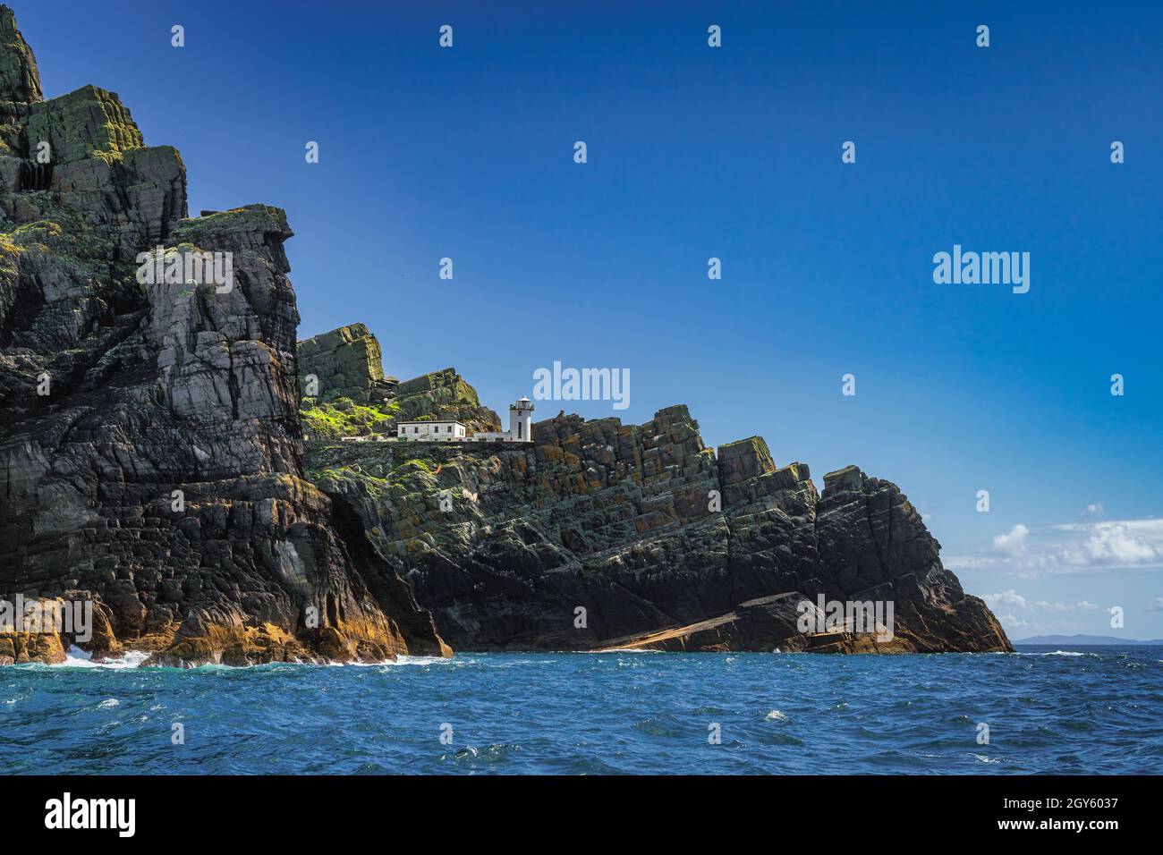 Skellig Lighthouse on the Skellig Michael island surrounded by Atlantic ...