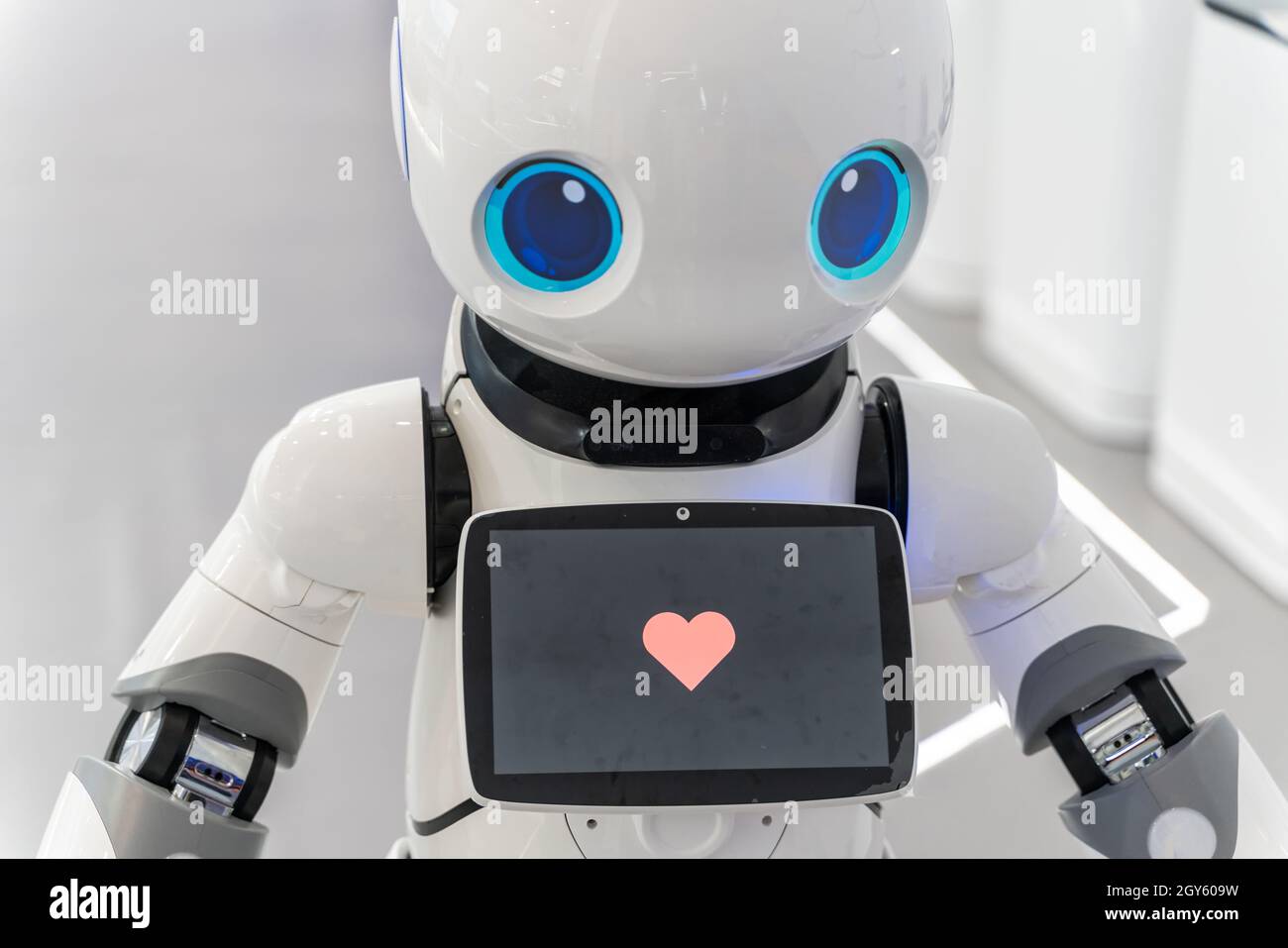 Robot display heart shape on screen to show love to mankind Stock Photo ...