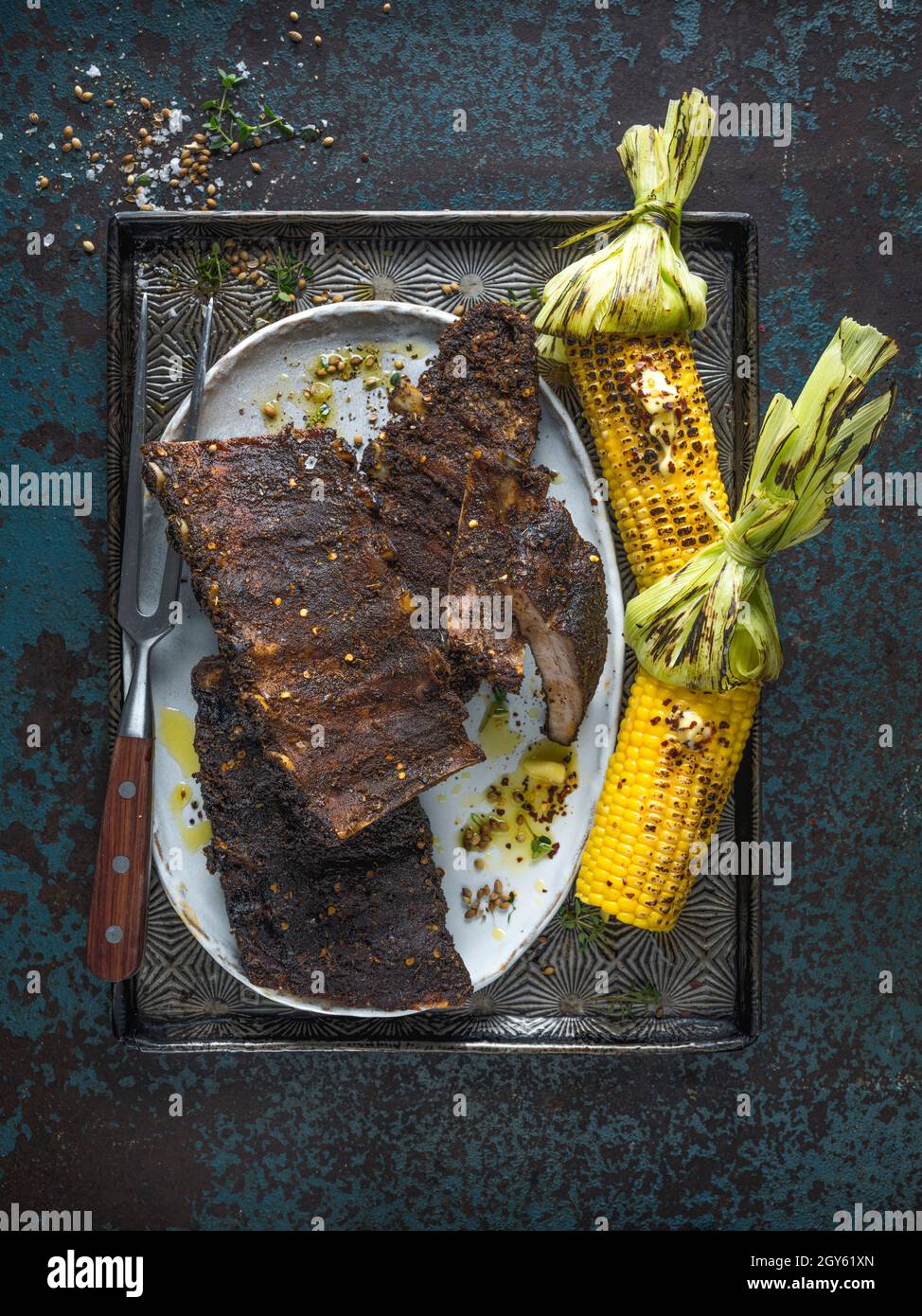 Dry Rubbed Smoked Ribs and sweetcorn Stock Photo - Alamy