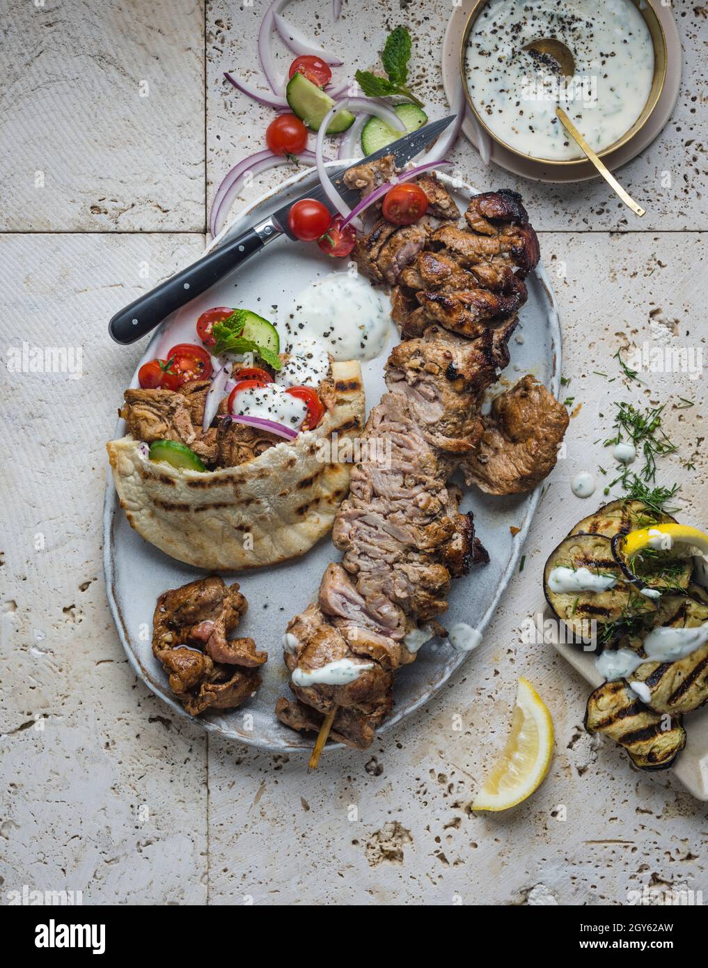 Pork Neck Skepasti served with pitta bread Stock Photo - Alamy