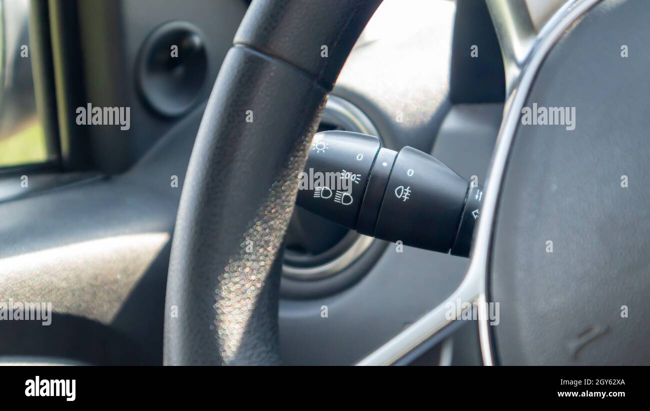Detailing the car. Close-up of the left arm of the car turn signal ...